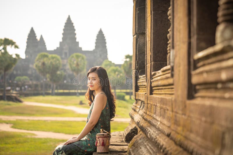 Portrait Of Beautiful Vietnamese Millennial Girl Posing Next To Angkor