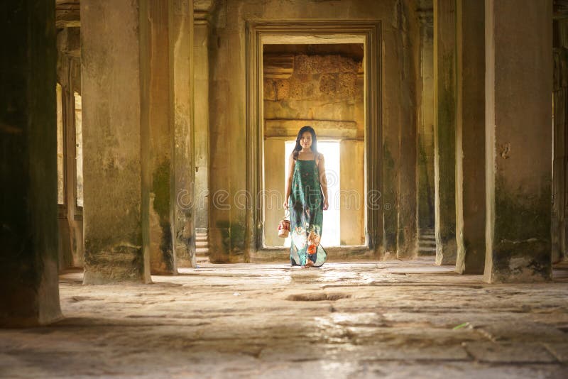 Portrait Of Beautiful Vietnamese Millennial Girl Posing Next To Angkor