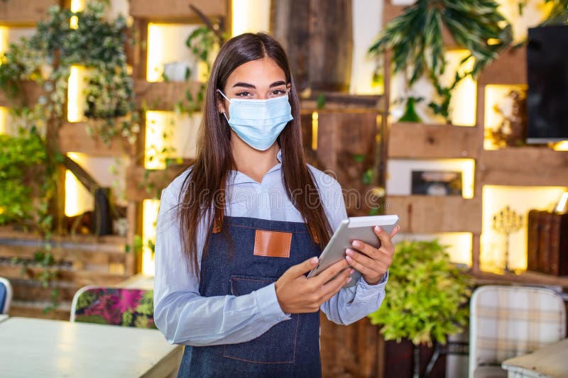Portrait of Beautiful Waitress Wearing Protective Face Mask while ...
