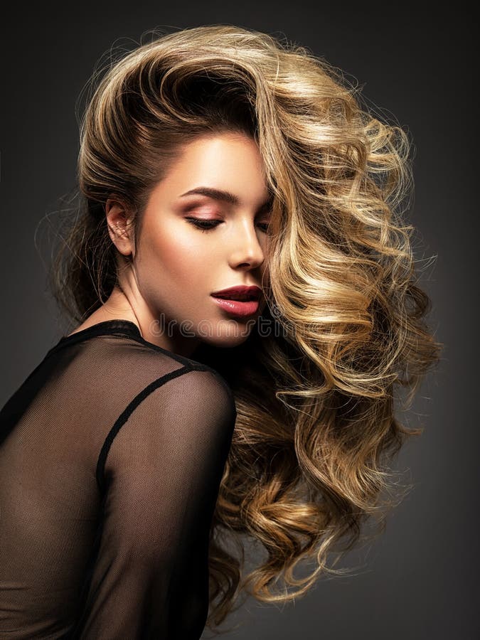 Face Of A Beautiful Woman With Long Brown Curly Hair Fashion Model