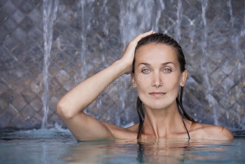 Woman in a Pool Under a Waterfall Stock Image - Image of model, care ...