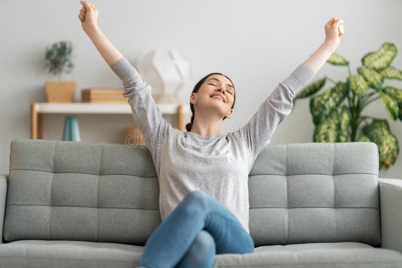 Woman Resting on Sofa at Home Stock Photo - Image of confident, living ...