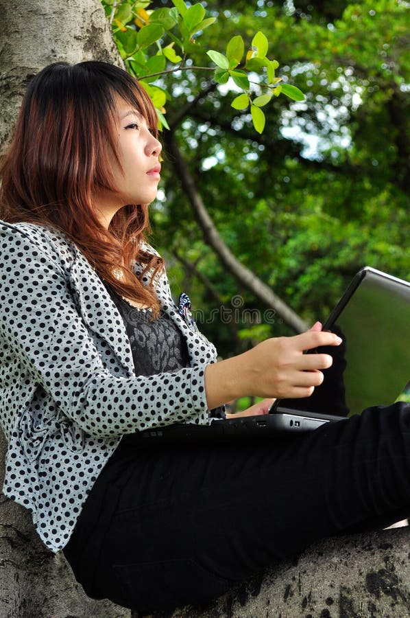 Portrait of Beautiful Woman Sitting on the Tree Stock Photo - Image of ...