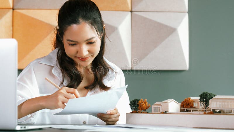 Young Architect Measure House Model while Taking a Note Blueprint ...