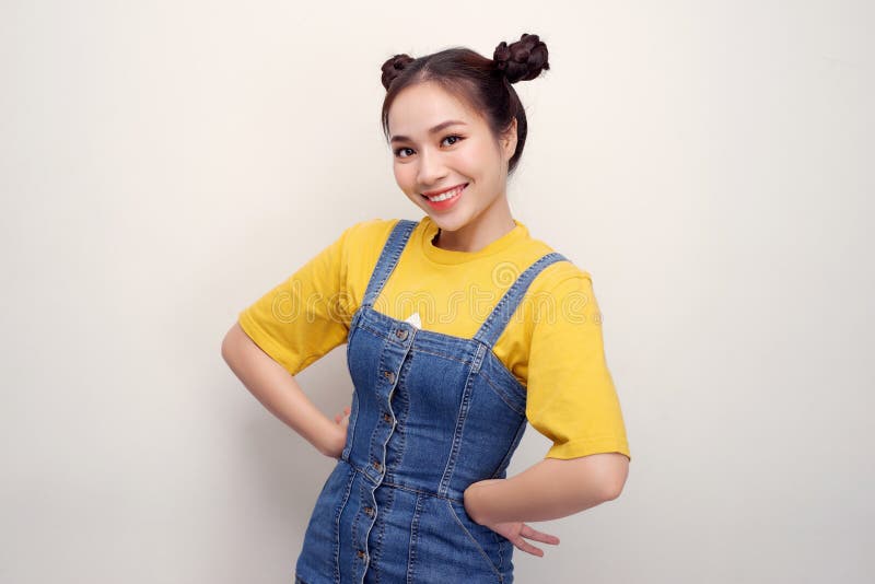 Portrait Of Beautiful Young Asian Woman With Hair Buns And Looking