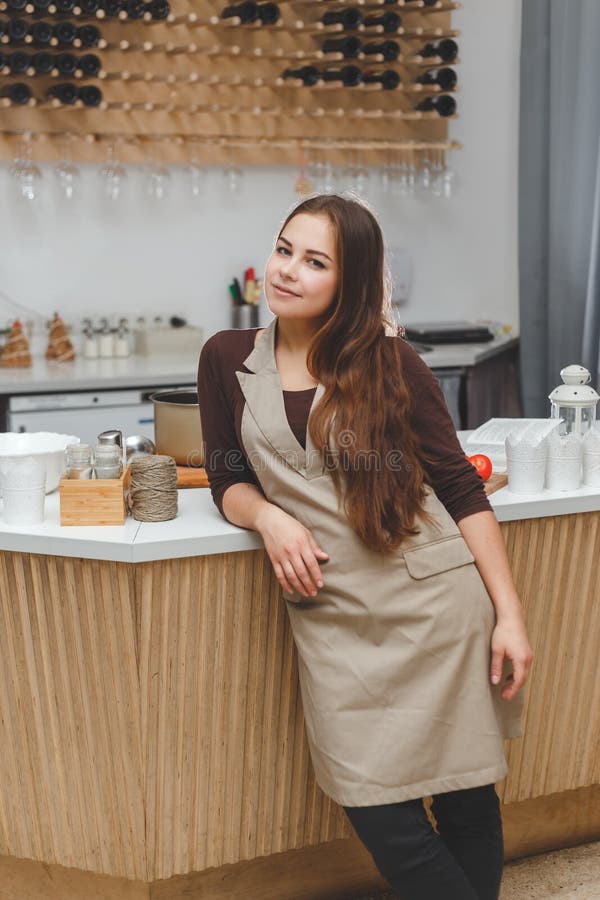 Portrait of Beautiful Young Barmaid in Apron Standing at the Bar Stock ...