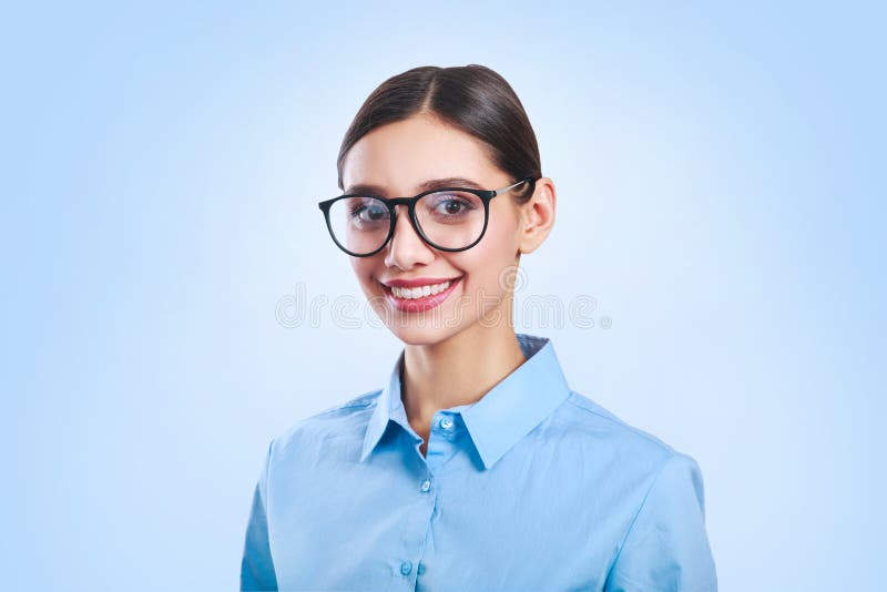 Portrait of a Beautiful Young Business Woman Standing Against Blue ... Portrait of a Beautiful Young Business Woman Standing Against Blue ...