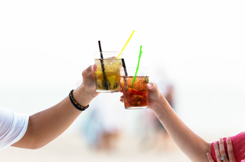 Beautiful Young Couple Drinking Refreshment on the Beach. Stock Image ...