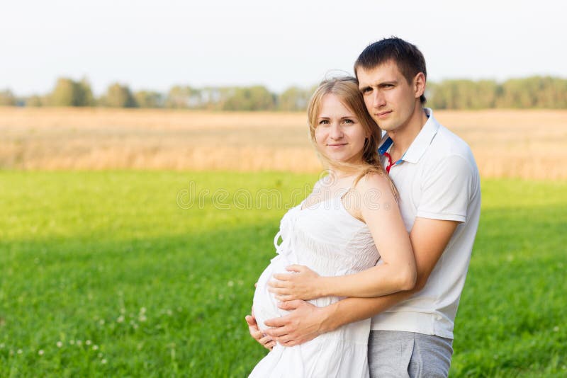 Portrait of Beautiful Young Future Parents Outdoors Stock Photo - Image ...