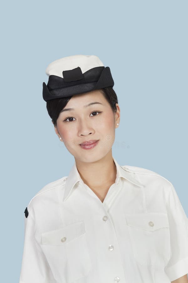 Portrait of a Beautiful Young US Navy Officer Over Light Blue ...