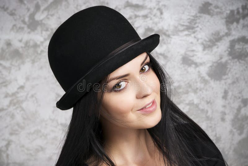 Portrait of a Beautiful Young Woman in a Bowler Hat Stock Photo - Image ...