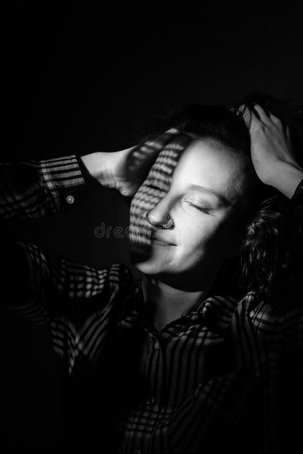 Portrait of a Beautiful Young Woman with a Creative Shadow Pattern on ...