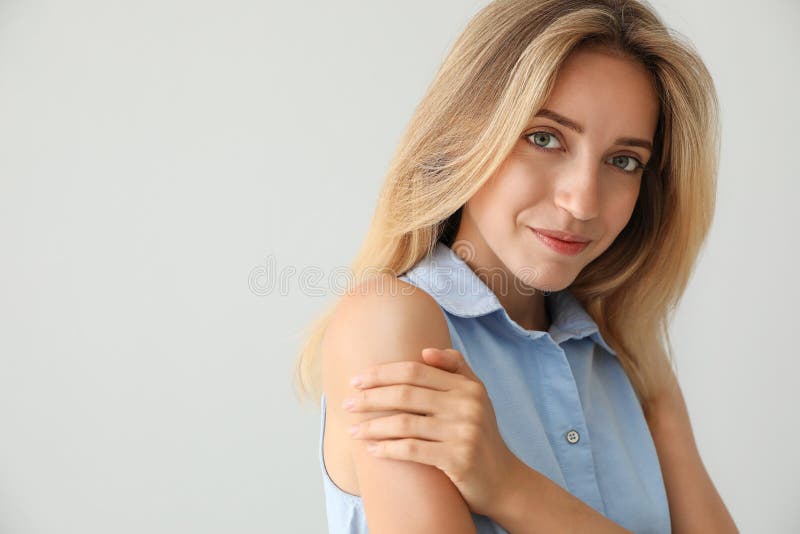 Portrait of Beautiful Young Woman on Light Background Stock Photo ...