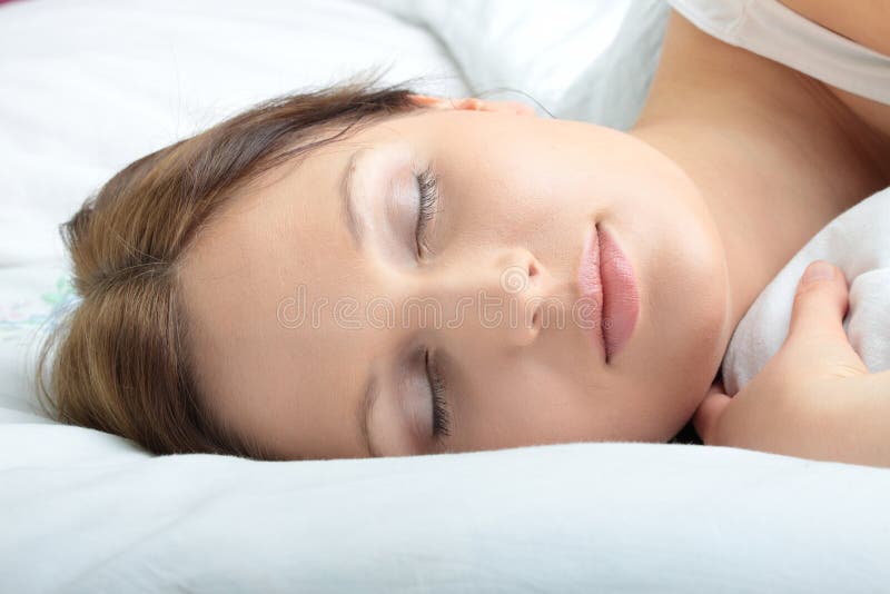 Beautiful Woman Sleeping and Smiles in His Sleep in Bed Stock Photo ...
