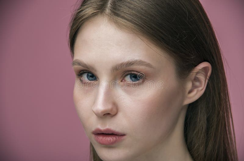 Portrait of a Beautiful Young Woman or Teenage Girl Posing Over Pink ... Portrait of a Beautiful Young Woman or Teenage Girl Posing Over Pink ...