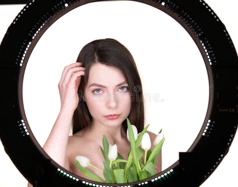 Portrait of a Beautiful Young Woman with White Tulips Made Using a Ring ...