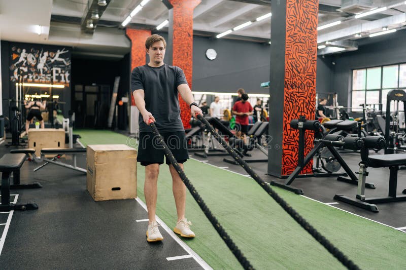 Portrait of Beginner Sportsman Doing Battle Ropes Functional Training ...