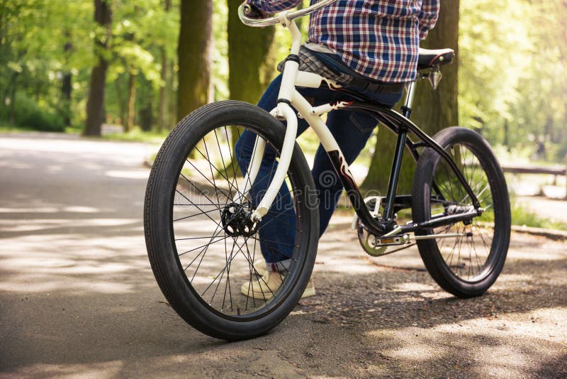 Portrait from Behind of Man Sitting on Bicycle at Park Stock Photo ...