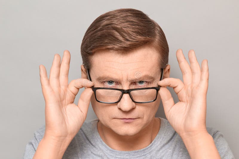 Portrait of Blond Mature Man Looking Attentively Over His Glasses Stock ... Portrait of Blond Mature Man Looking Attentively Over His Glasses Stock ...