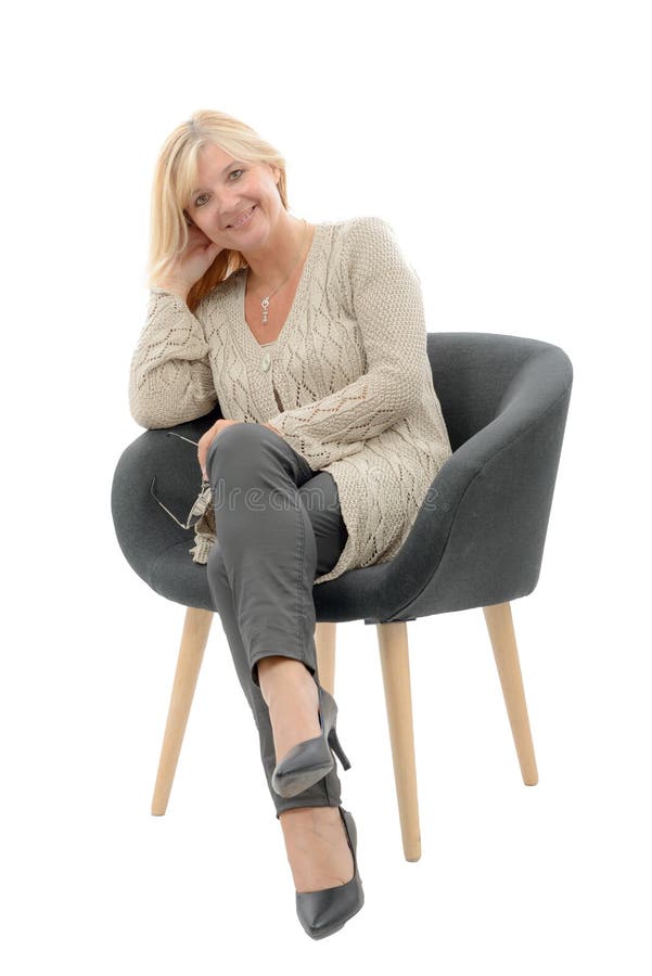 Portrait of Blond Mature Woman Relaxing in Armchair Stock Image - Image ... Portrait of Blond Mature Woman Relaxing in Armchair Stock Image - Image ...