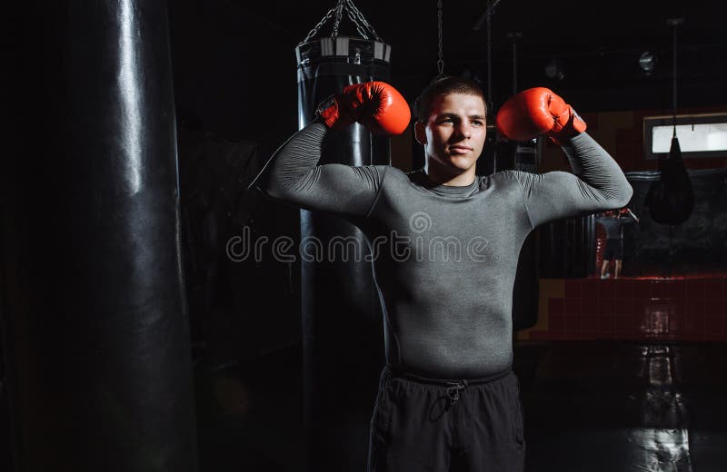 Portrait of a Boxer in the Gym, a Man Looks Aggressive Stock Photo ...