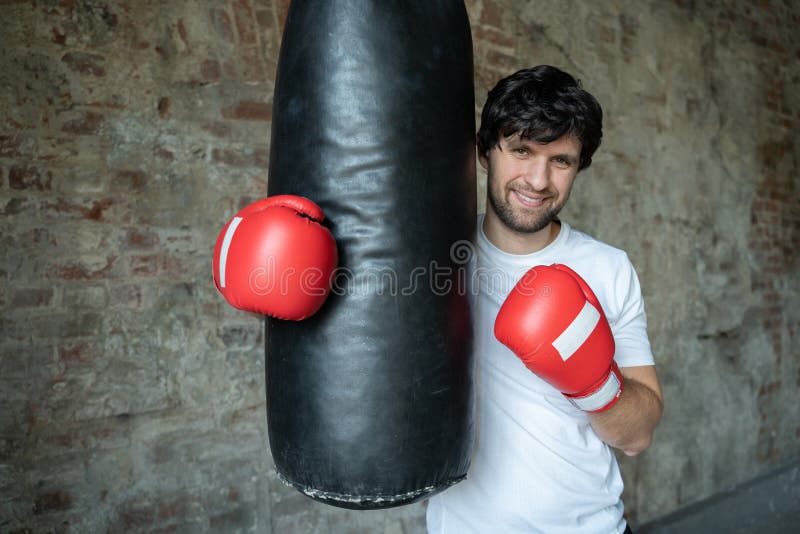 Portrait Boxing Guy Posing Next To Punch Bag in Gym Stock Image - Image ...