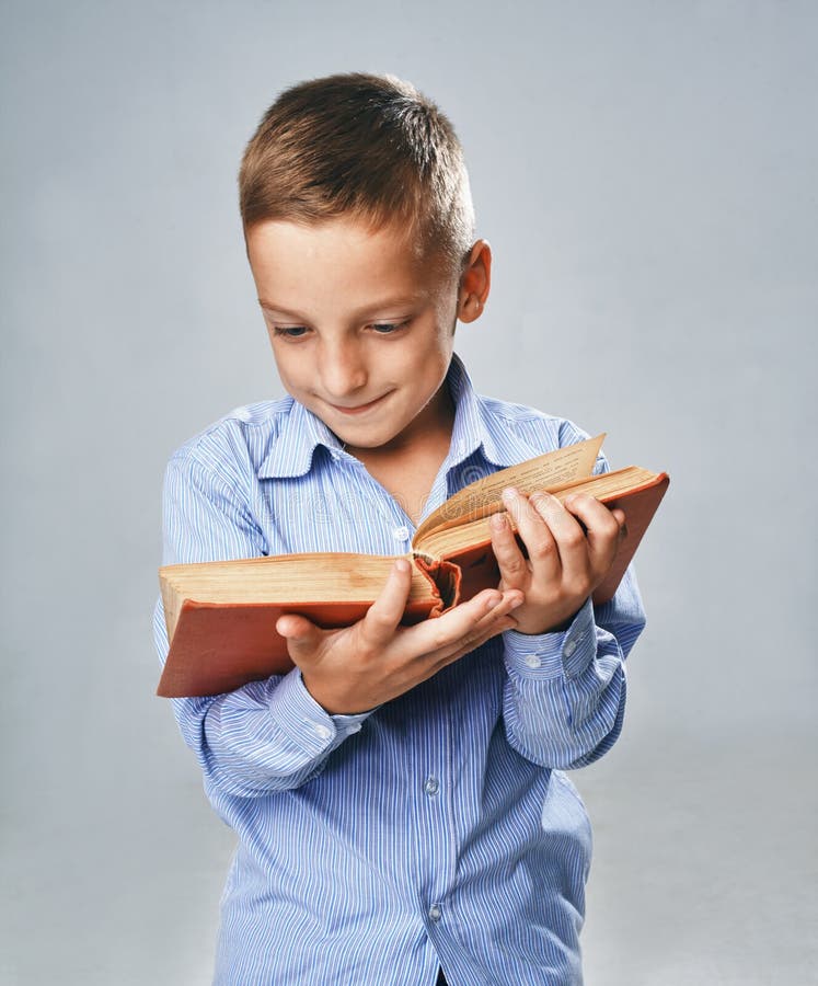 A Portrait of a Boy with a Big Book Stock Photo - Image of cheerful ...