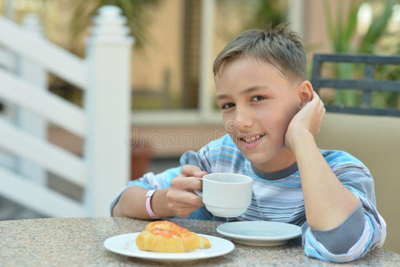 Portrait of Boy Drinking Tea with Croissants Stock Photo - Image of ...