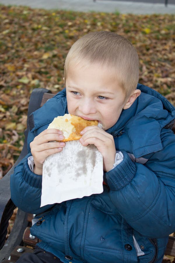 Portrait of a boy eating stock photo. Image of holding - 72738826