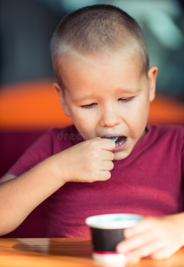 Portrait of a Boy Eating Ice Cream Stock Image - Image of enjoyment ...