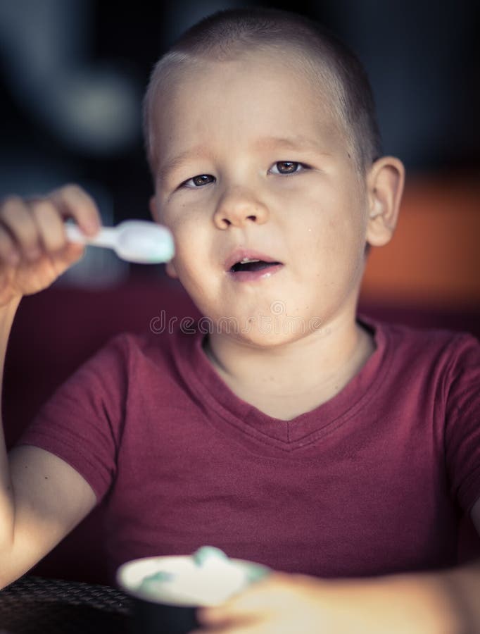Portrait of a Boy Eating Ice Cream Stock Photo - Image of casual, food ...