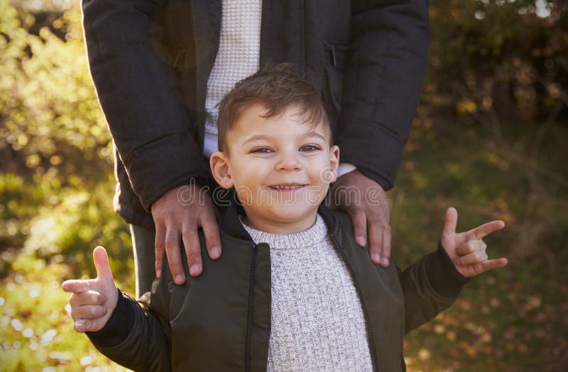Portrait of Boy with Father Standing in Autumn Garden Stock Photo ...