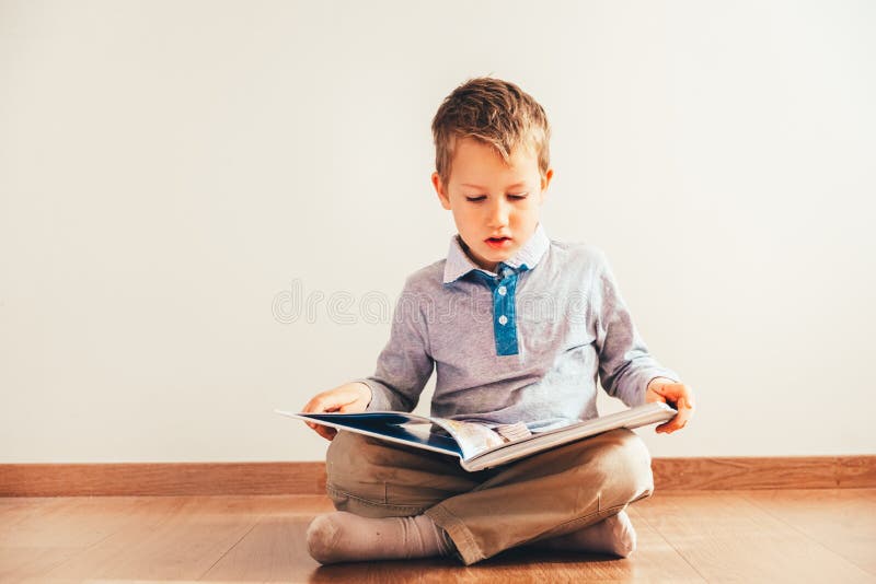 Portrait of Boy Interested in Reading a Book Stock Photo - Image of ...