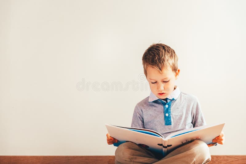 Portrait of Boy Interested in Reading a Book Stock Image - Image of ...