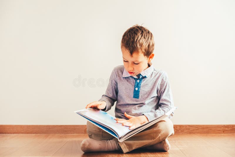 Portrait of Boy Interested in Reading a Book Stock Image - Image of ...