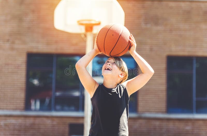 Portrait of a Boy Kid Playing with a Basketball in Park Stock Photo ...