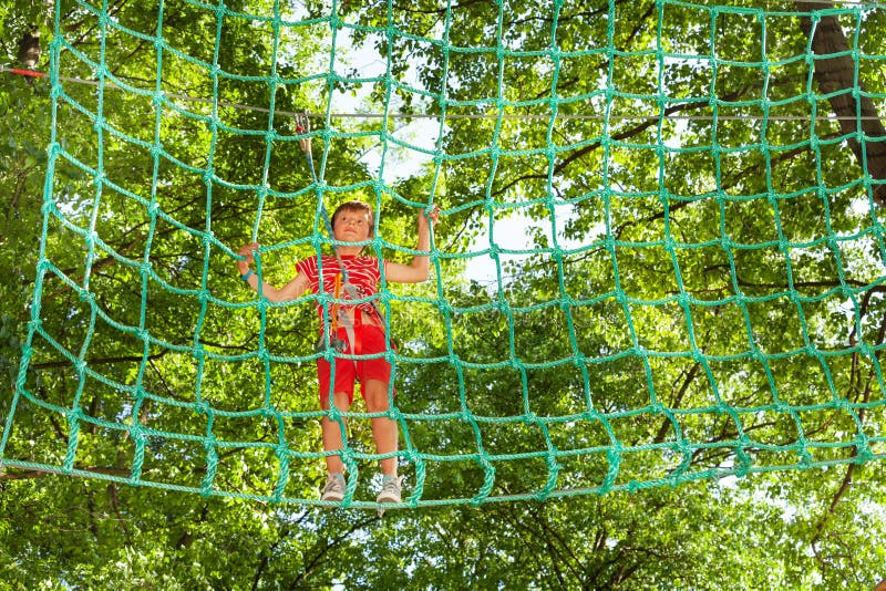 Portrait of a Boy Limb on Net in the Rope Park Stock Image - Image of ...