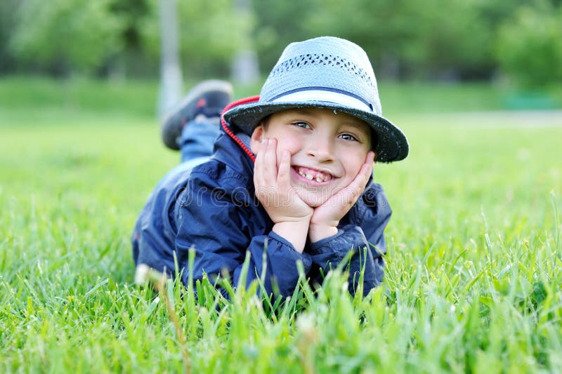 Portrait of Boy Lying on Green Grass Stock Image - Image of happiness ...