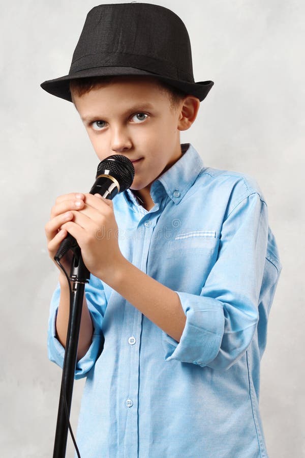 Portrait of a Boy with a Microphone Stock Photo - Image of studio ...