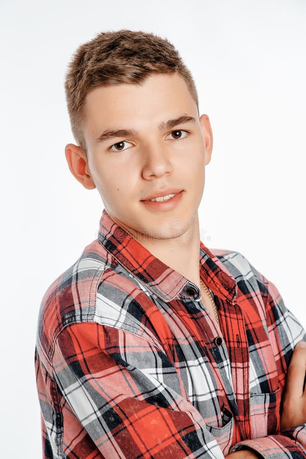Portrait of a Boy in a Photo Studio. Young Man Posing on a White ...