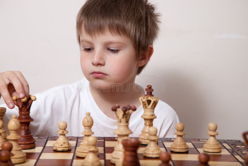 Portrait of a Boy Playing Chess Stock Photo - Image of indoor, blue ...