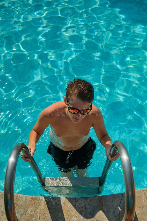 Portrait of a Boy on the Pool Stairs Stock Photo - Image of relaxation ...