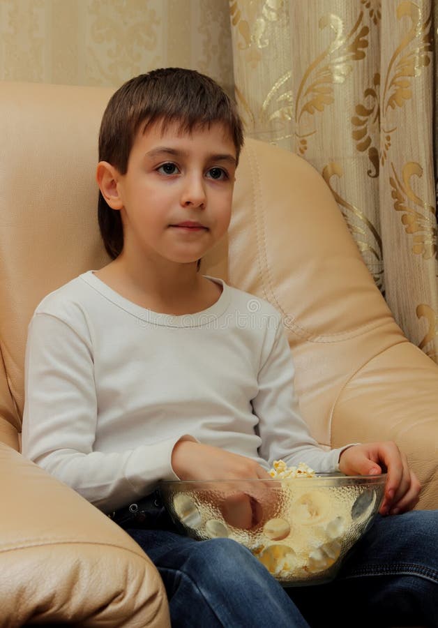 Portrait of a Boy Sitting on a Chair with Popcorn Stock Image - Image ...