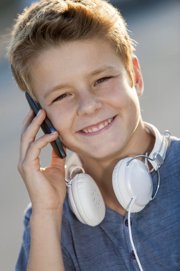 Portrait of Boy Talking on Phone Outdoors. Stock Photo - Image of ...