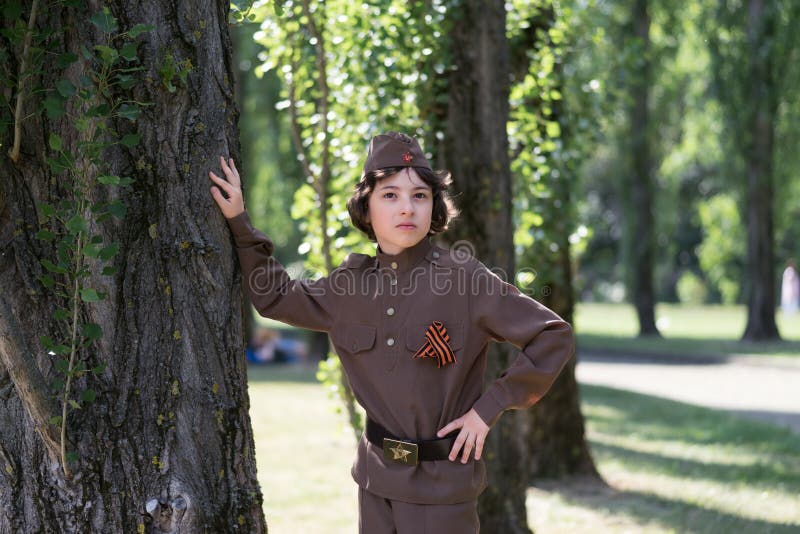 Portrait of a Boy in the Uniform of a Soldier. Stock Photo - Image of ...