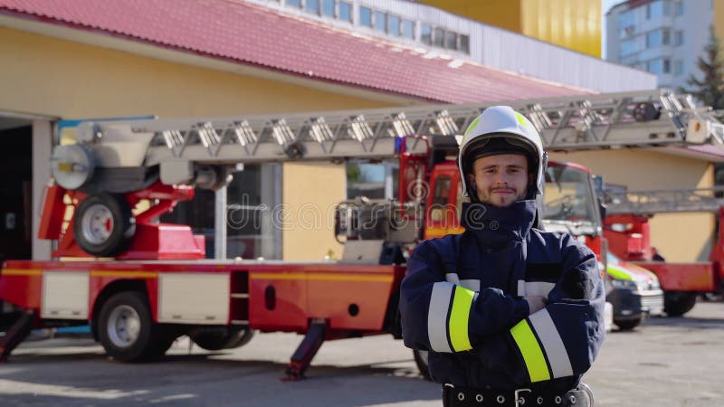 Portrait of Brave Fireman with Helmet Near Fire Engine. Firefighter ...
