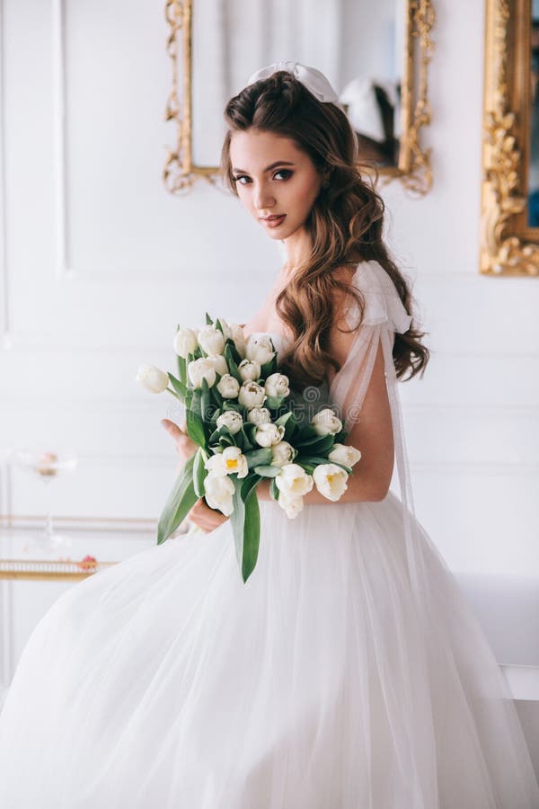 Portrait of a Beautiful Bride with a Bouquet in Studio Stock Photo ...