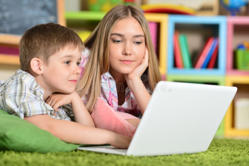 Bother And Sister Using Laptop Stock Image - Image of exploring, life ...