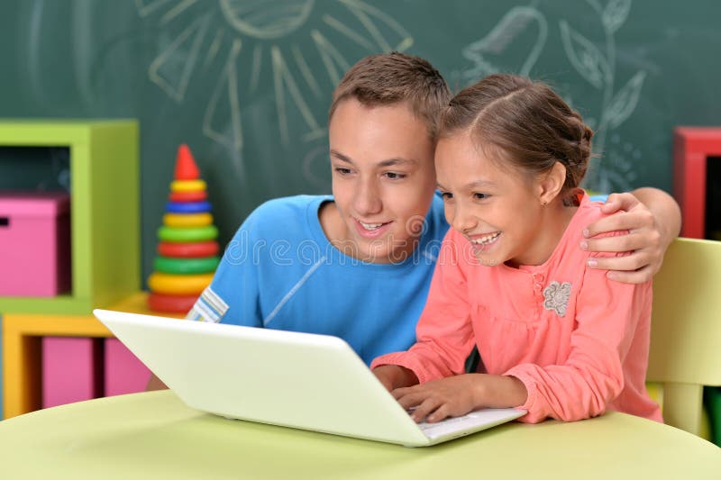 Portrait of Brother and Sister Using Laptop Stock Image - Image of ...