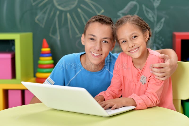 Portrait of Brother and Sister Using Laptop Stock Photo - Image of ...